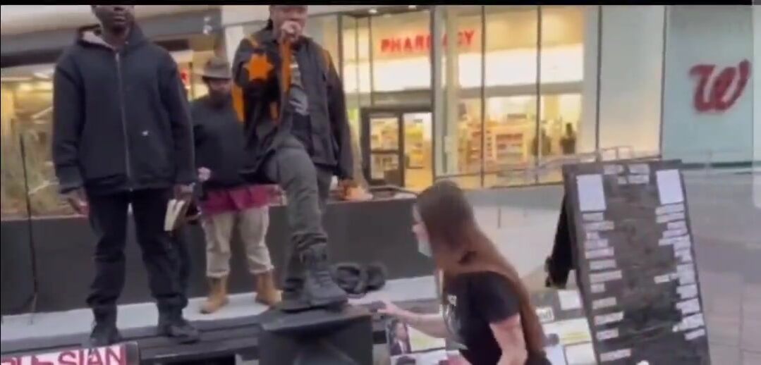 Woman bends at the knee to become a real life boot licker